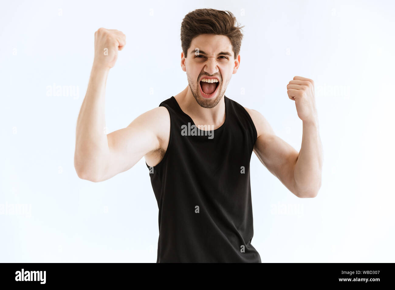 Image of a screaming attractive strong young sports man running ...