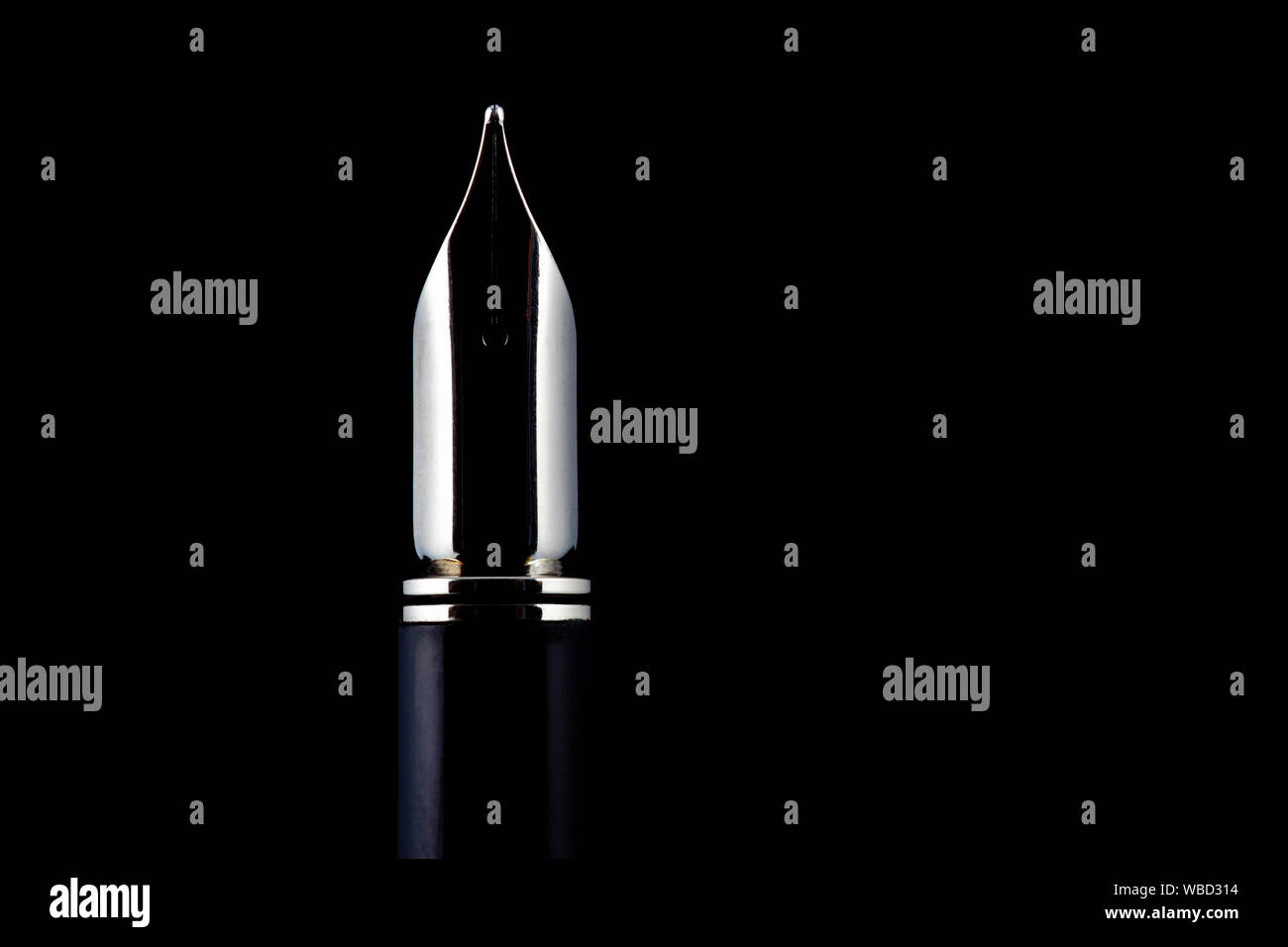 Traditional Fountain Pen nib isolated against a black background Stock ...