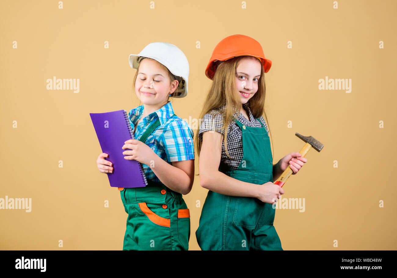 Kids girls with tools planning renovation. Family remodeling house ...