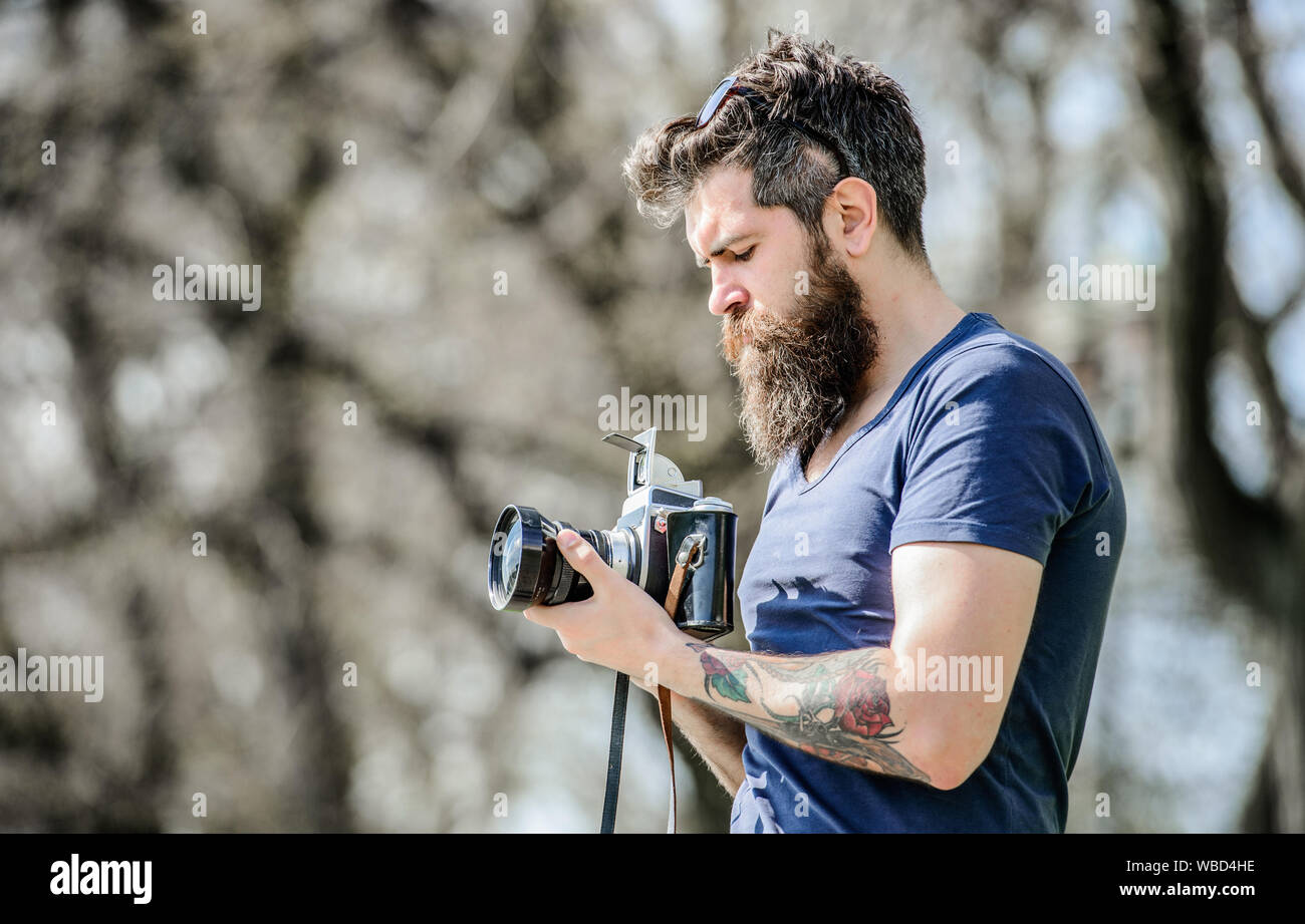Modern blogger. Content creator. Man bearded hipster photographer ...