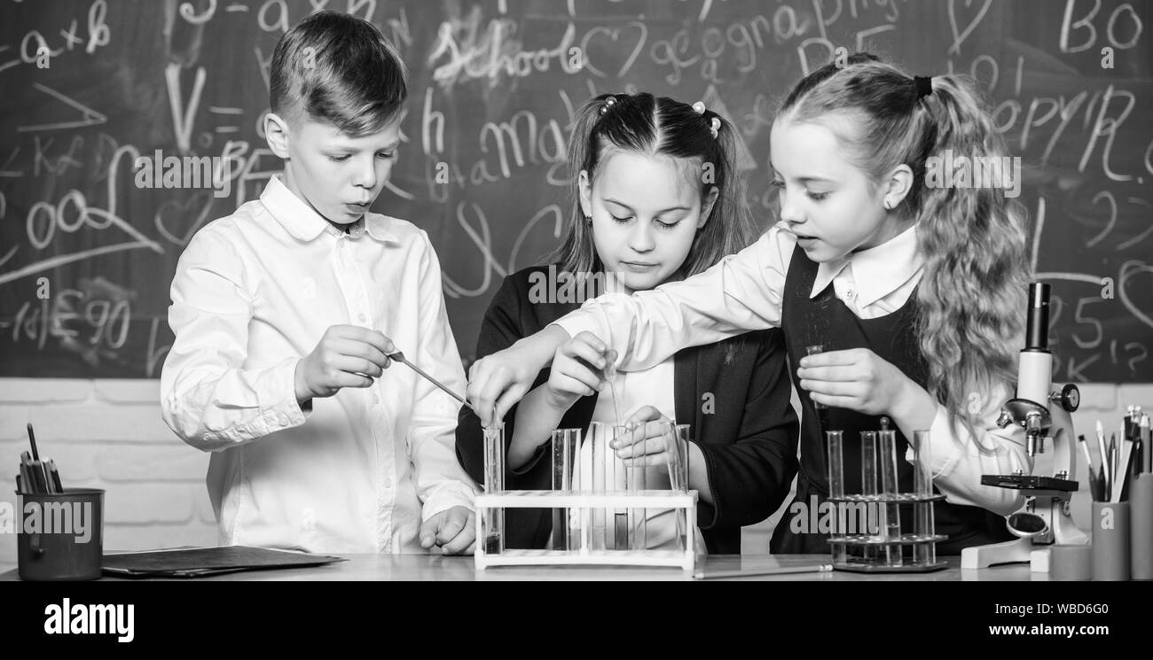 students doing biology experiments with microscope in lab. biology ...