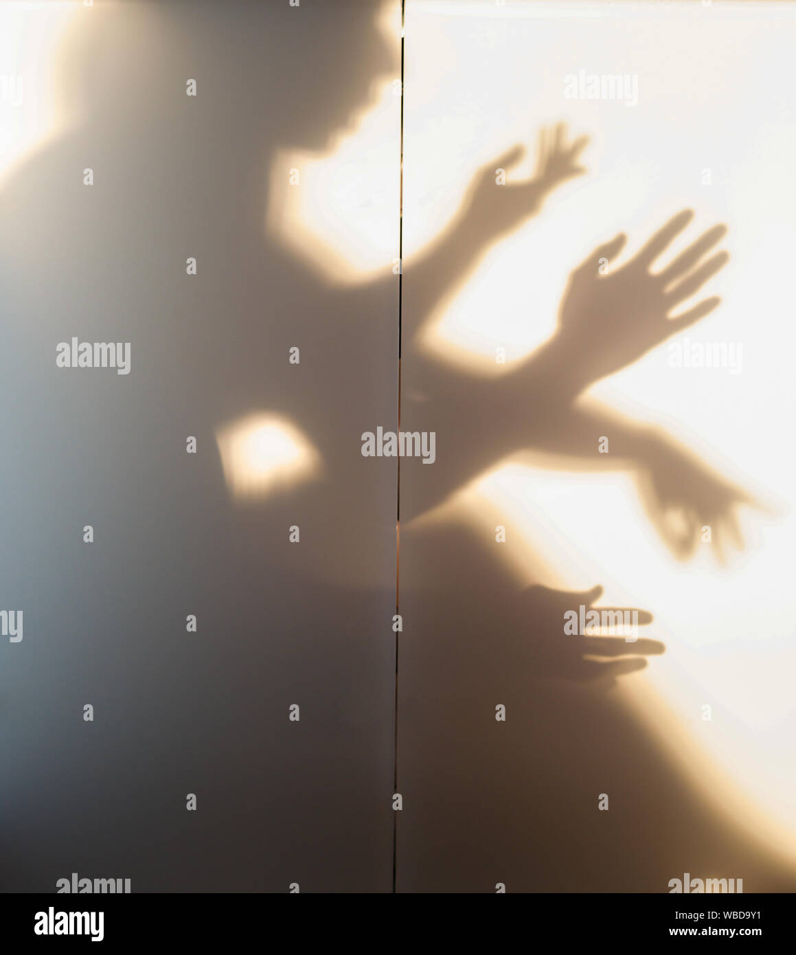 silhouette of people behind glass Stock Photo - Alamy