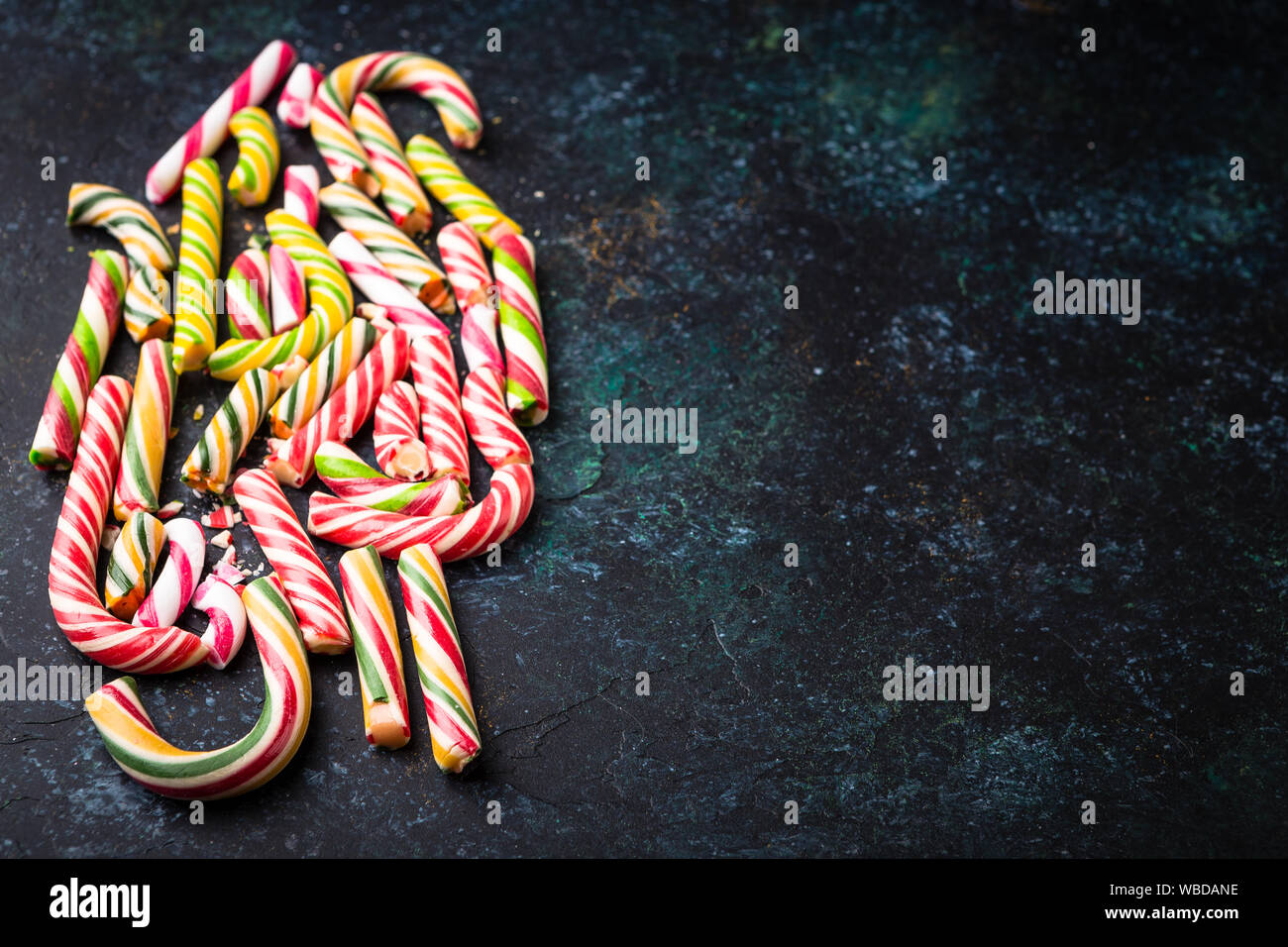 High angle view of a broken candy cane on dark background Stock Photo ...