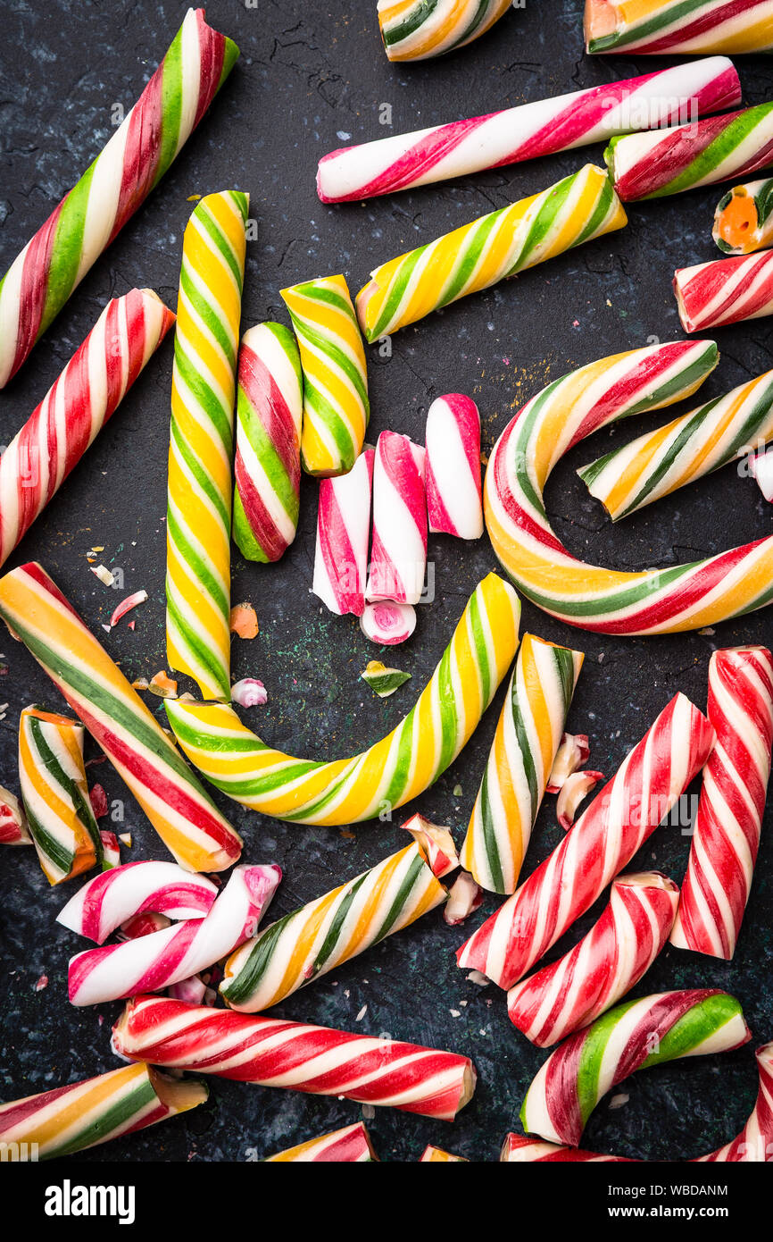 High angle view of a broken candy cane on dark background Stock Photo ...