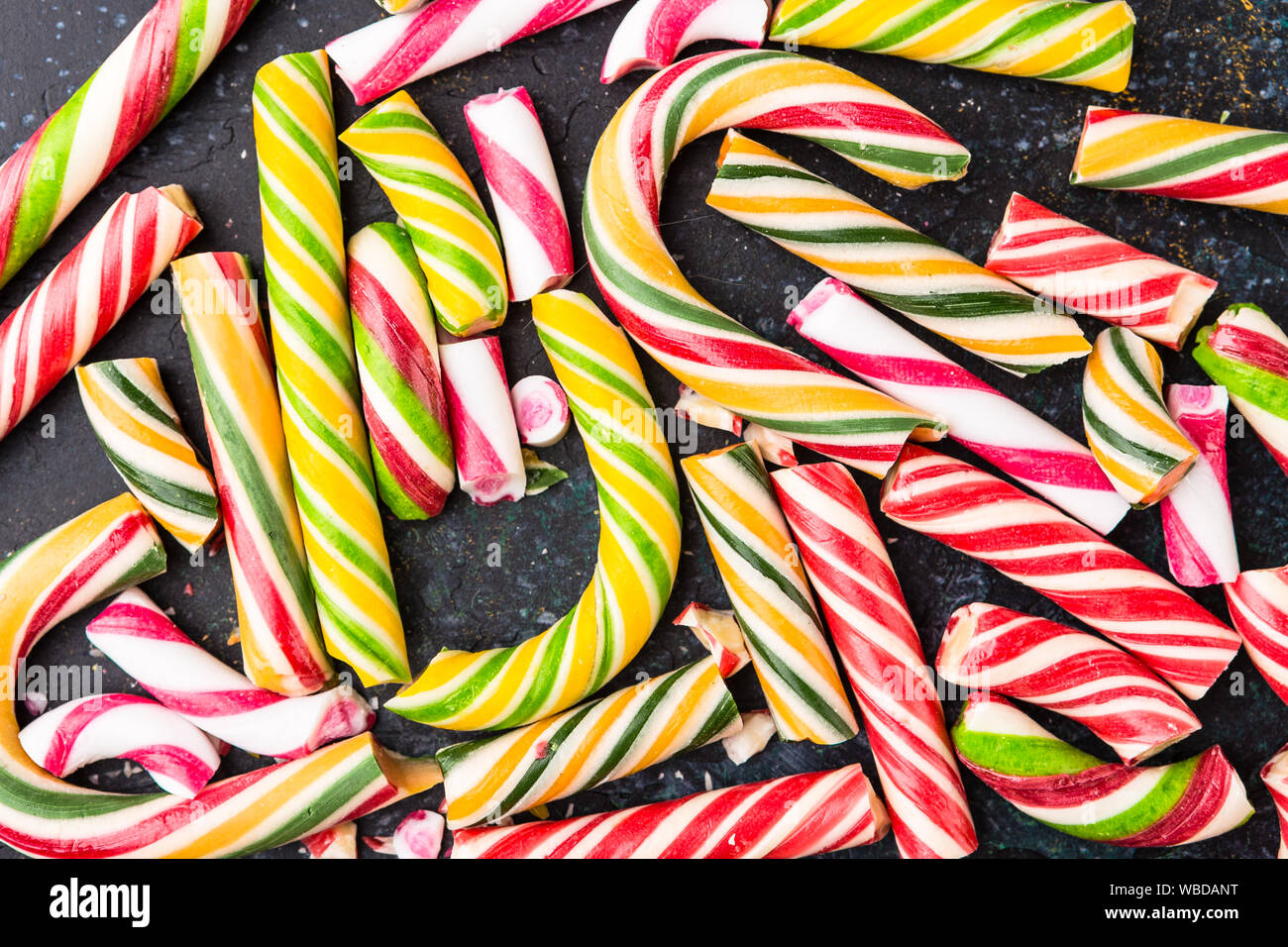 High angle view of a broken candy cane on dark background Stock Photo ...