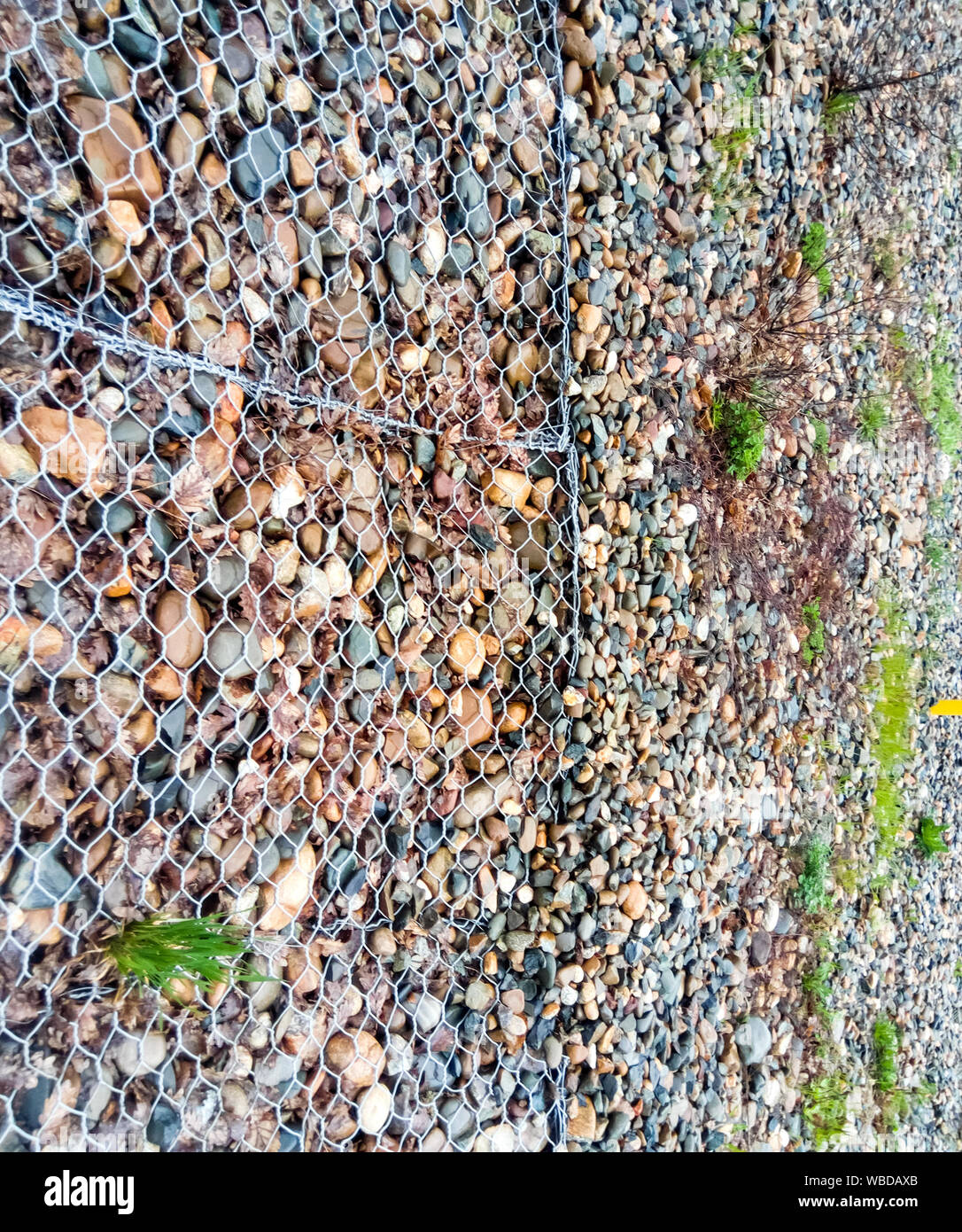 Retaining net on the slope. The net keeps the pebble from scattering ...