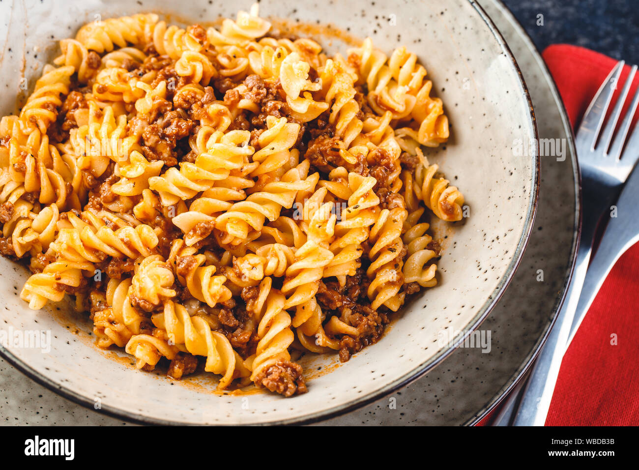 Pasta fusilli with bolognese tomato beef sauce. Traditional italian ...