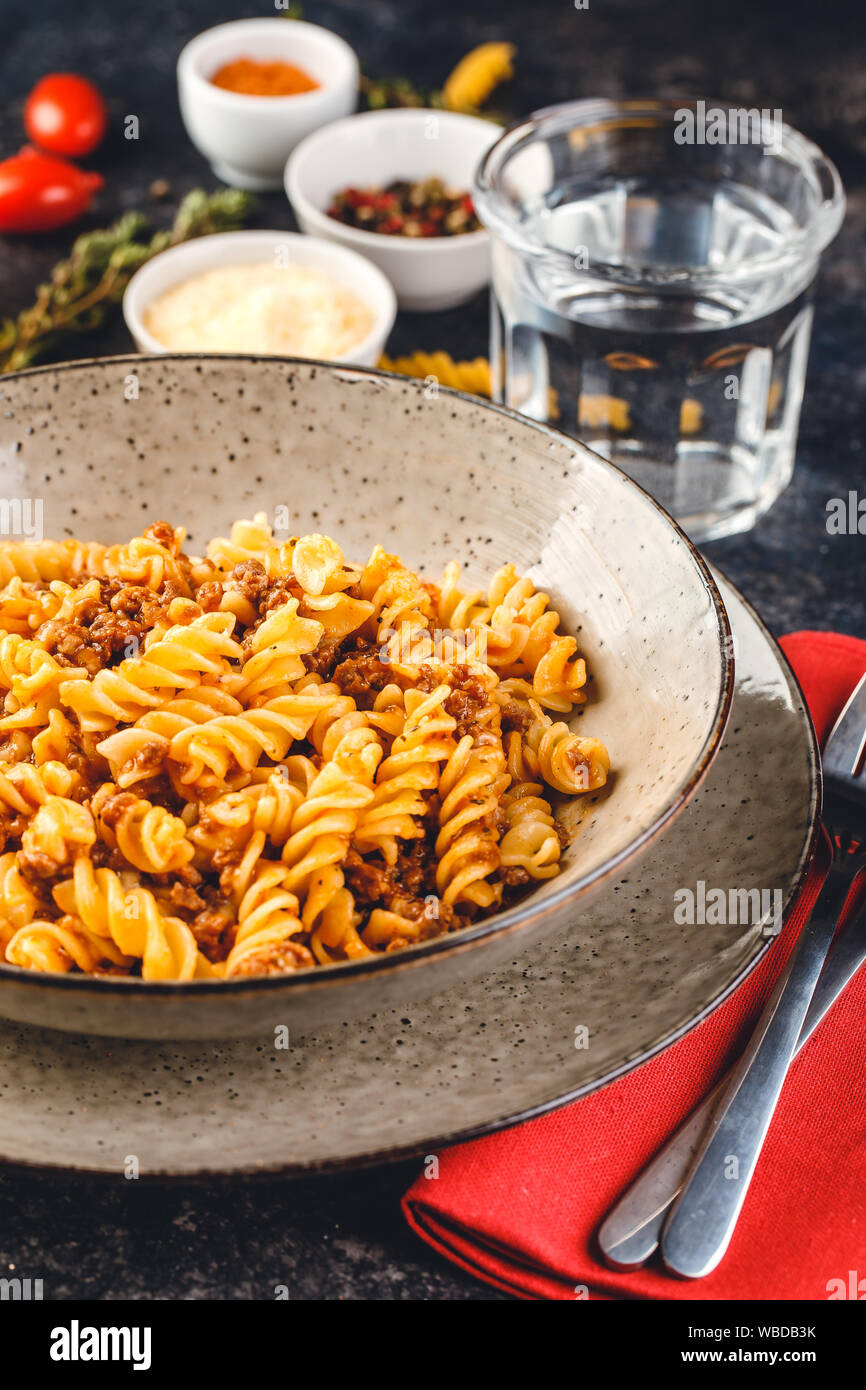 Pasta fusilli with bolognese tomato beef sauce. Traditional italian ...