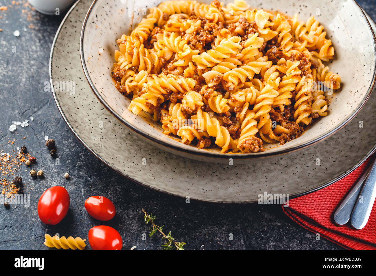Pasta fusilli with bolognese tomato beef sauce. Traditional italian ...