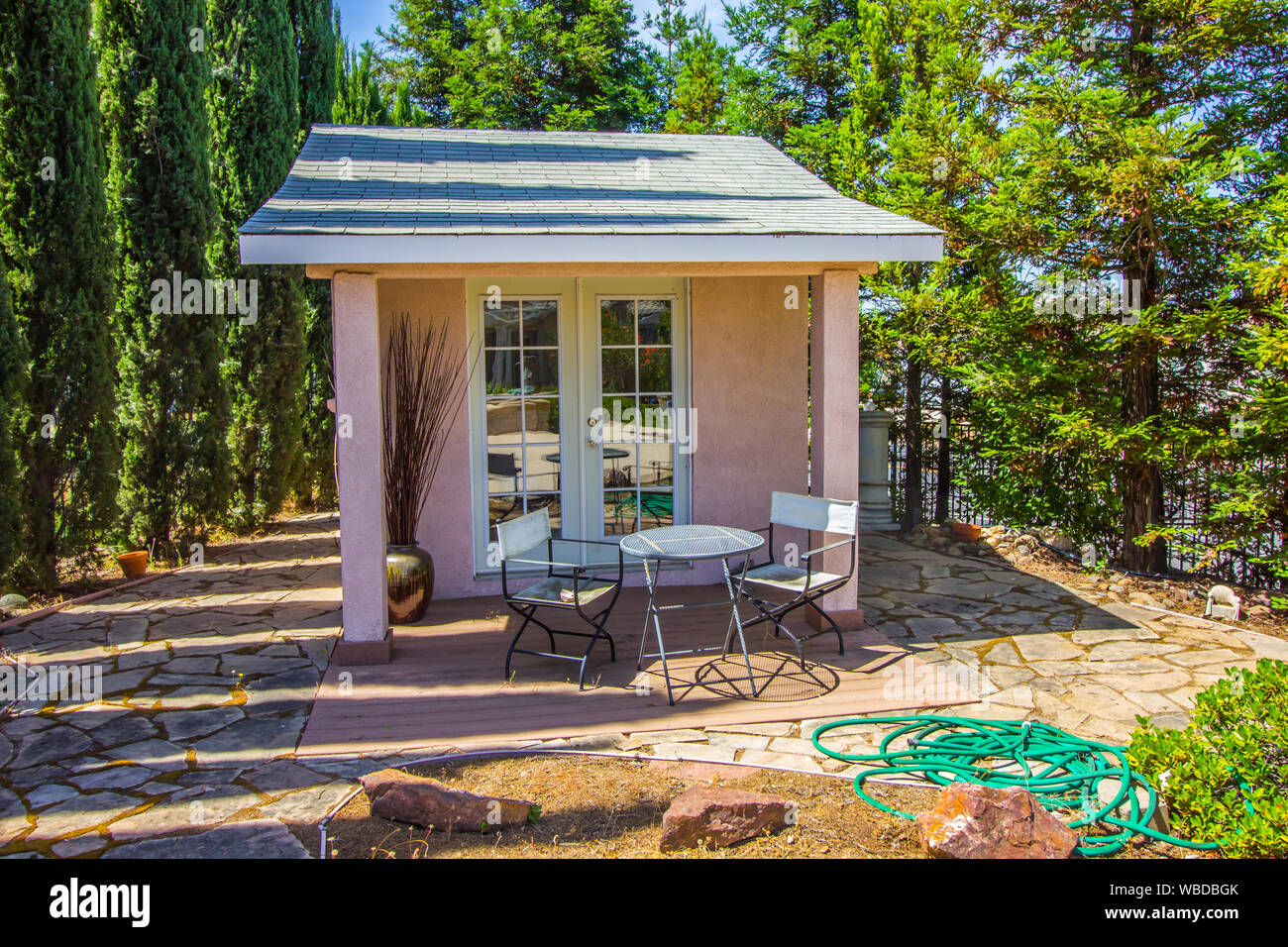 Small Pool House Cabana With Double Doors Stock Photo - Alamy