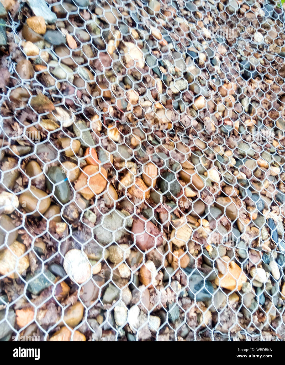 Retaining net on the slope. The net keeps the pebble from scattering ...