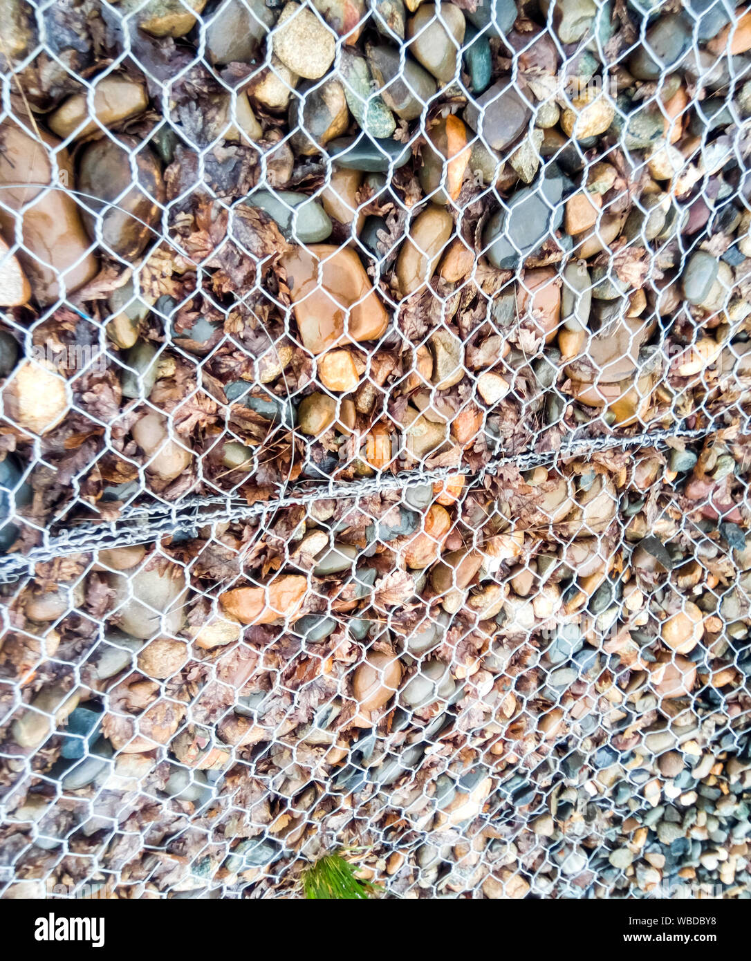 Retaining net on the slope. The net keeps the pebble from scattering ...