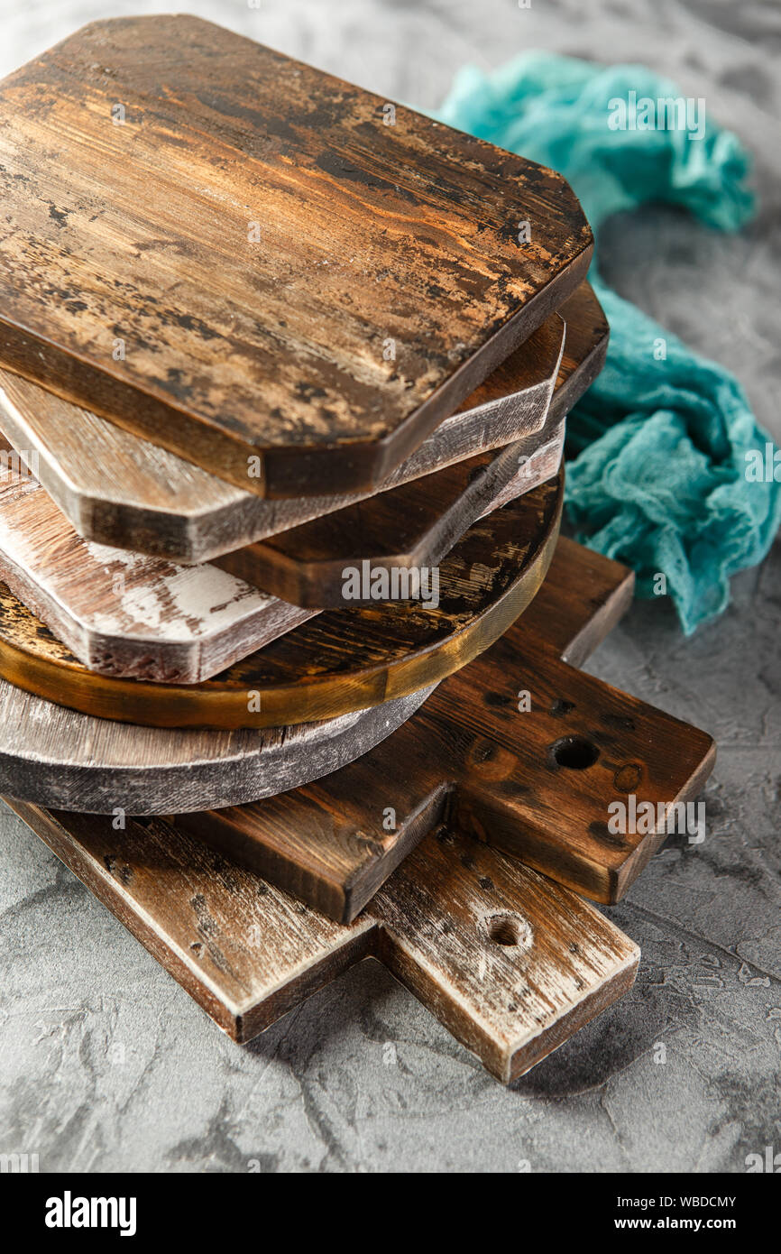 Stack of different wooden cutting boards on grey background Stock Photo ...