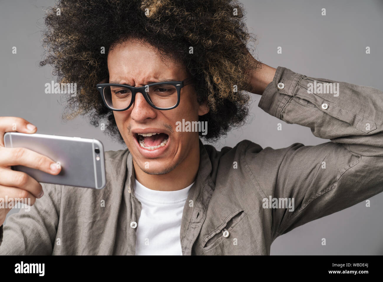 Photo closeup of nervous unhappy man with afro hairstyle losing video ...