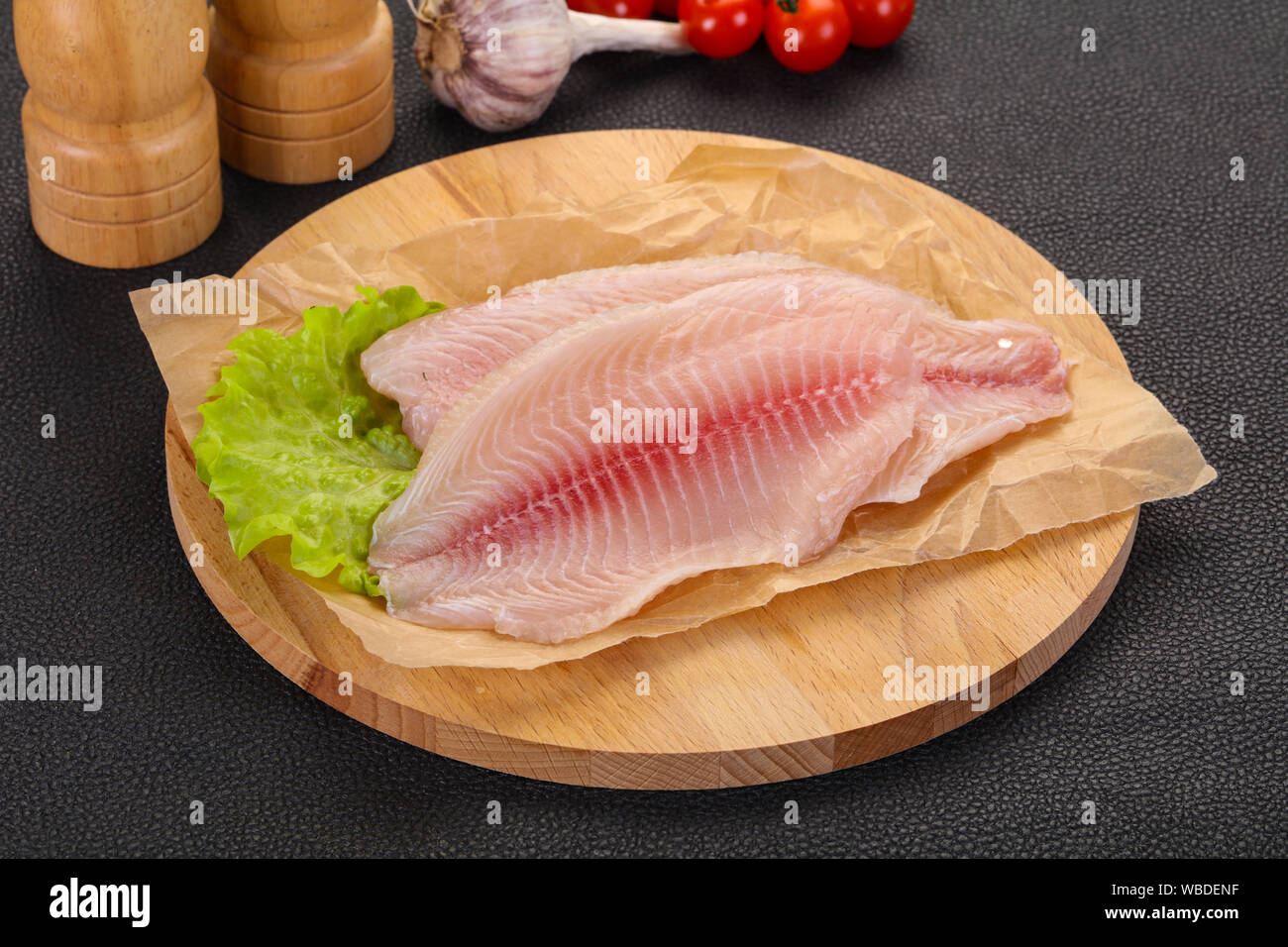 Raw tilapia fish ready for cooking Stock Photo - Alamy