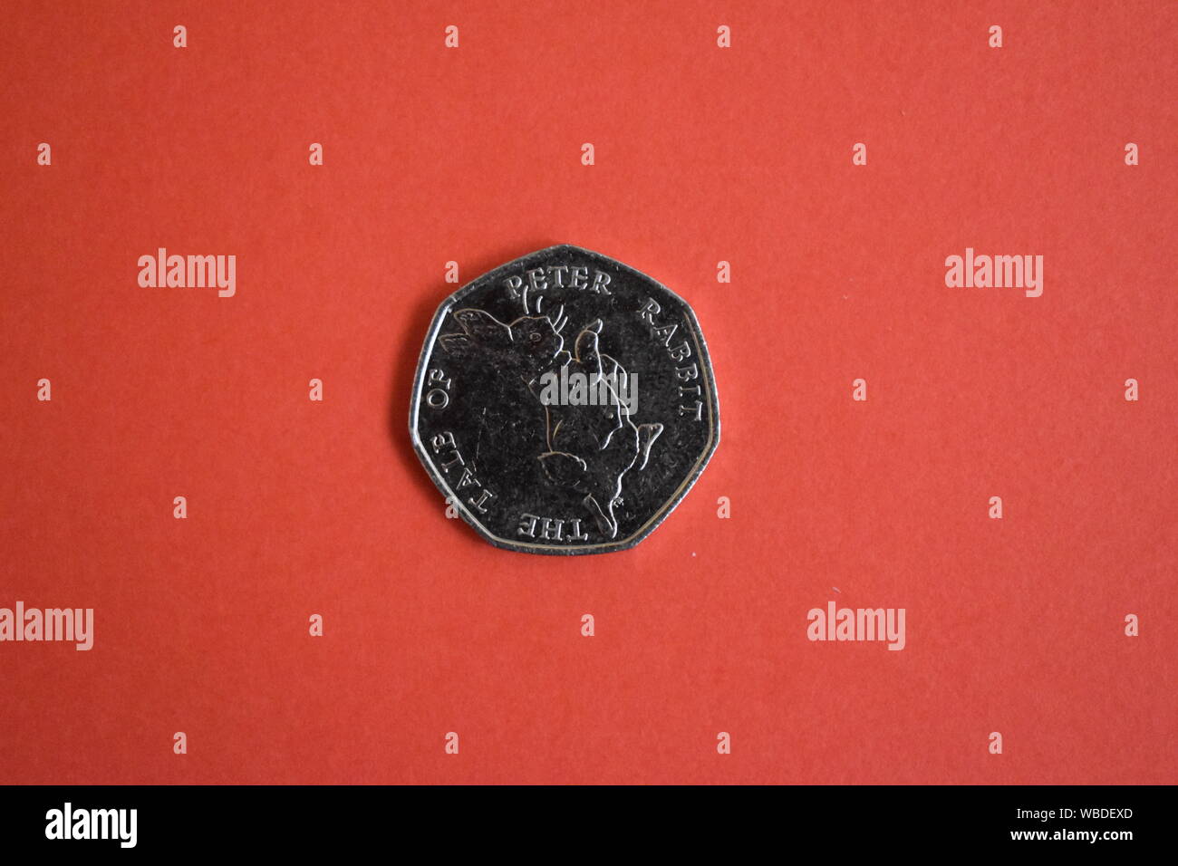 The Tales Of Peter Rabbit circulated 50p collectable coin on a dark ...
