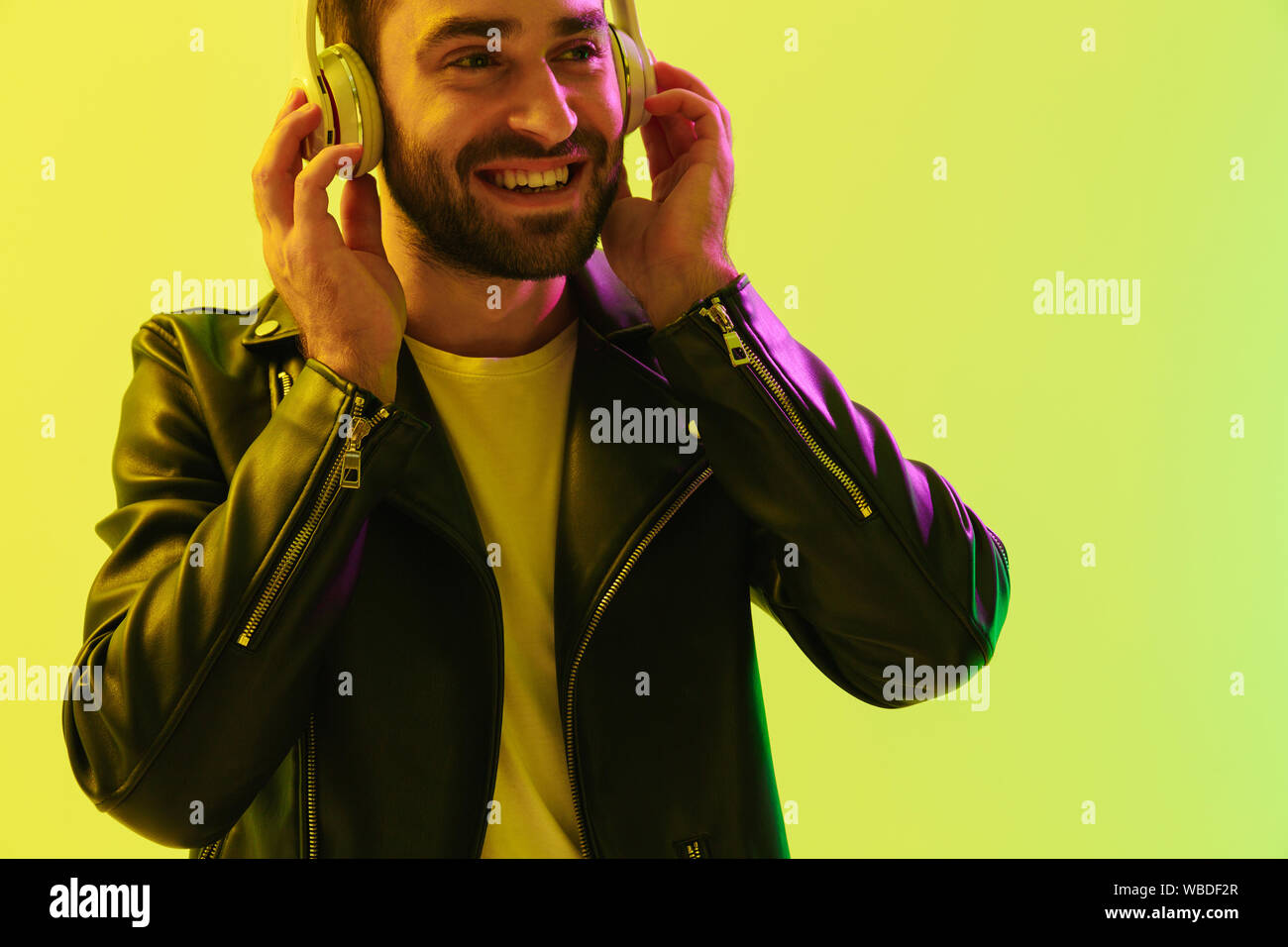 Picture of smiling pleased handsome young stylish man posing isolated ...