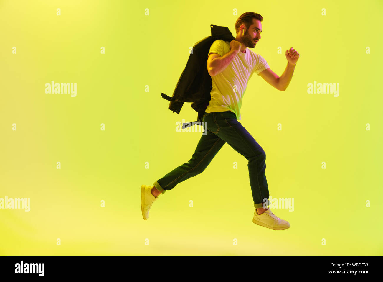 Man looking over shoulder running hi-res stock photography and images ...