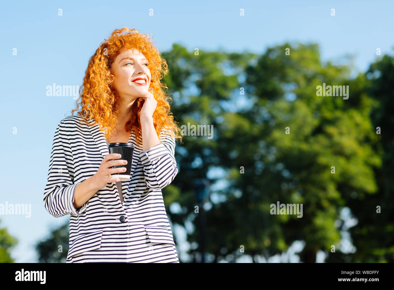 Positive delighted young female enjoying sunny day Stock Photo - Alamy