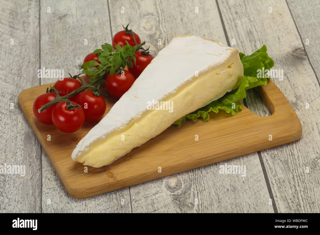 Brie cheese triangle served salad leaves Stock Photo - Alamy