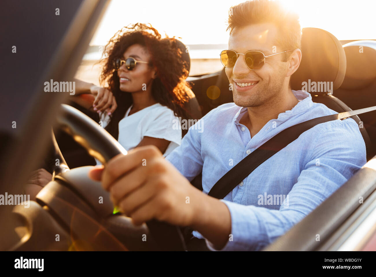 Two male friends driving open hi-res stock photography and images - Alamy