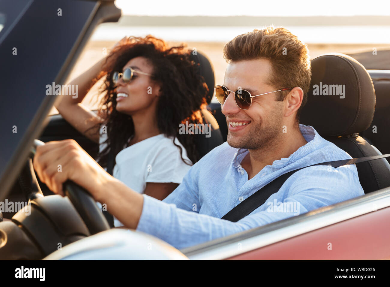 Driving riding interracial couple hi-res stock photography and images ...