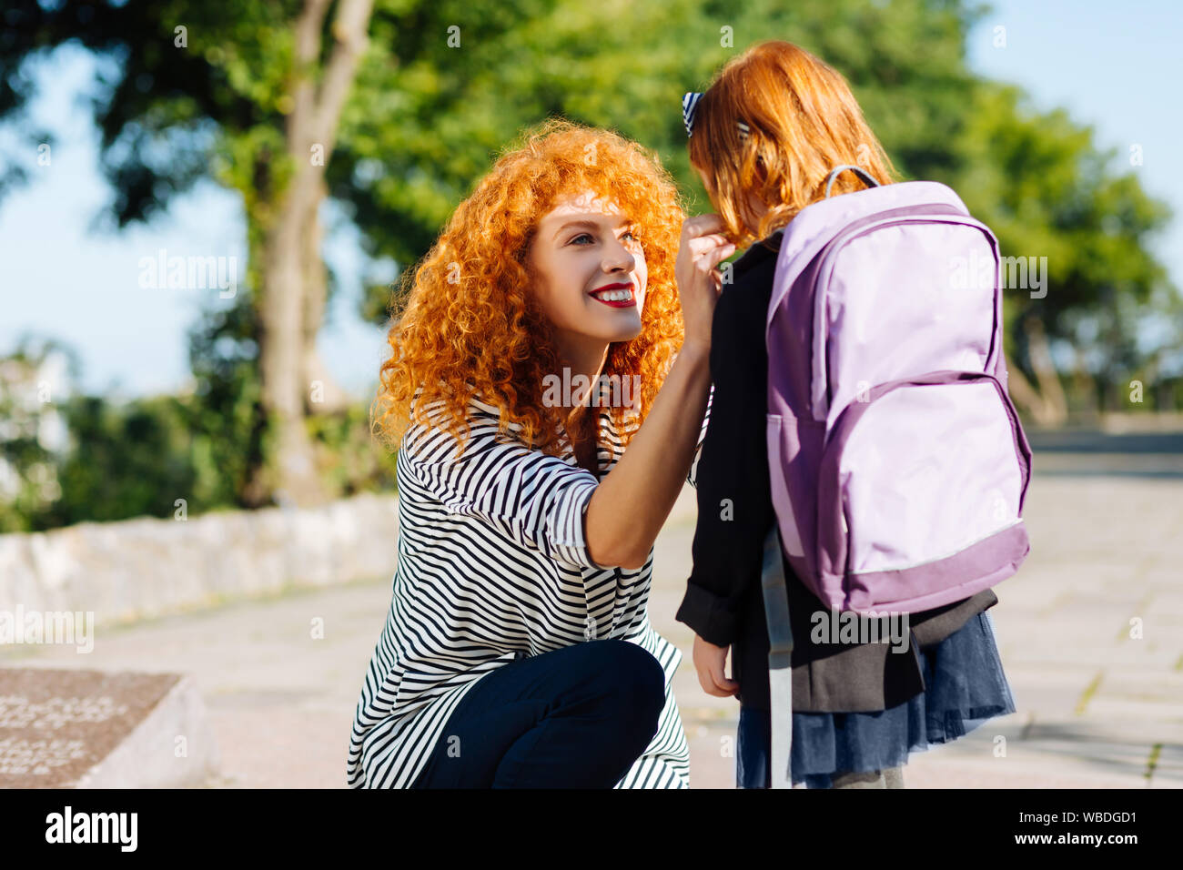 Amazing pupil communicating with her mom before school Stock Photo - Alamy