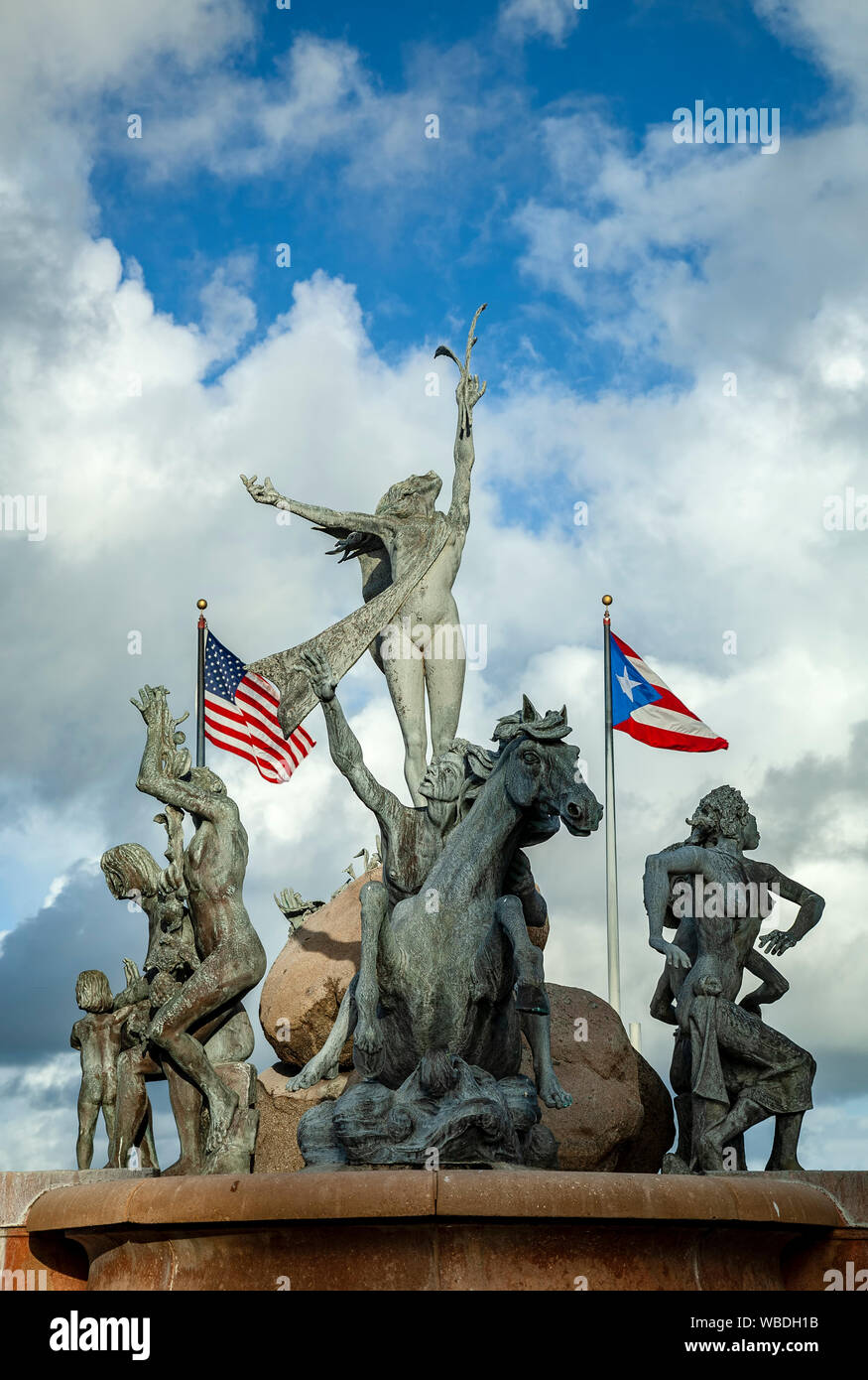 Flags and "Raices" (Roots) statue, Old San Juan, Puerto Rico Stock ...