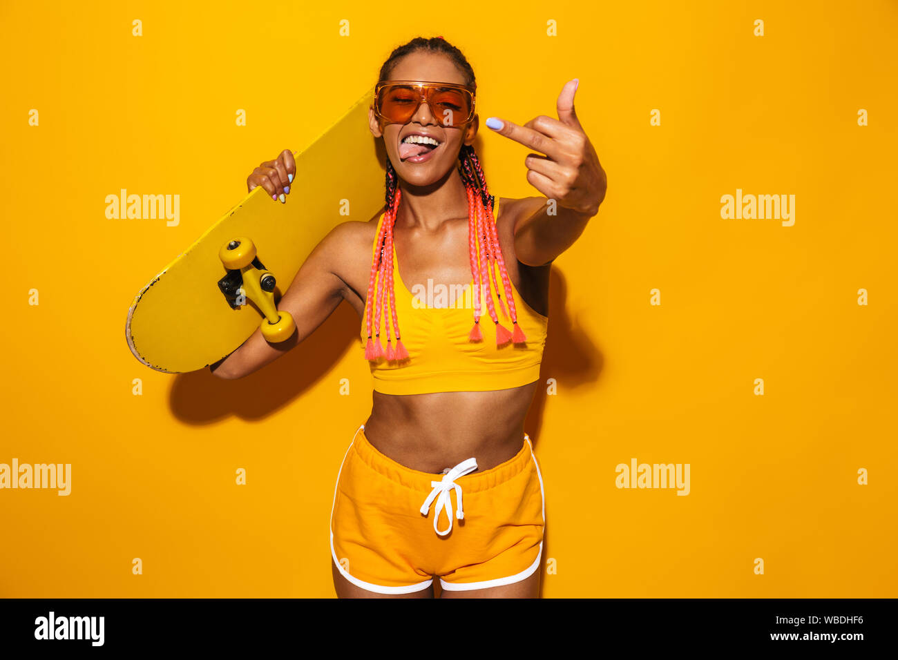 Image of sassy african american woman wearing sunglasses holding ...