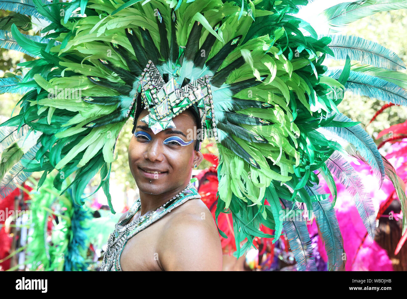 A reveler poses for a photograph the the Notting Hill Carnival in west ...