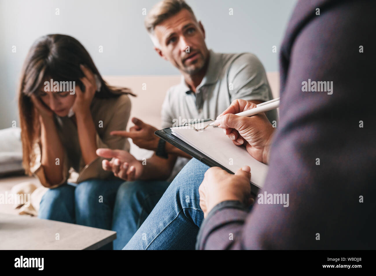 Photo of upset irritated couple man and woman having conversation with ...