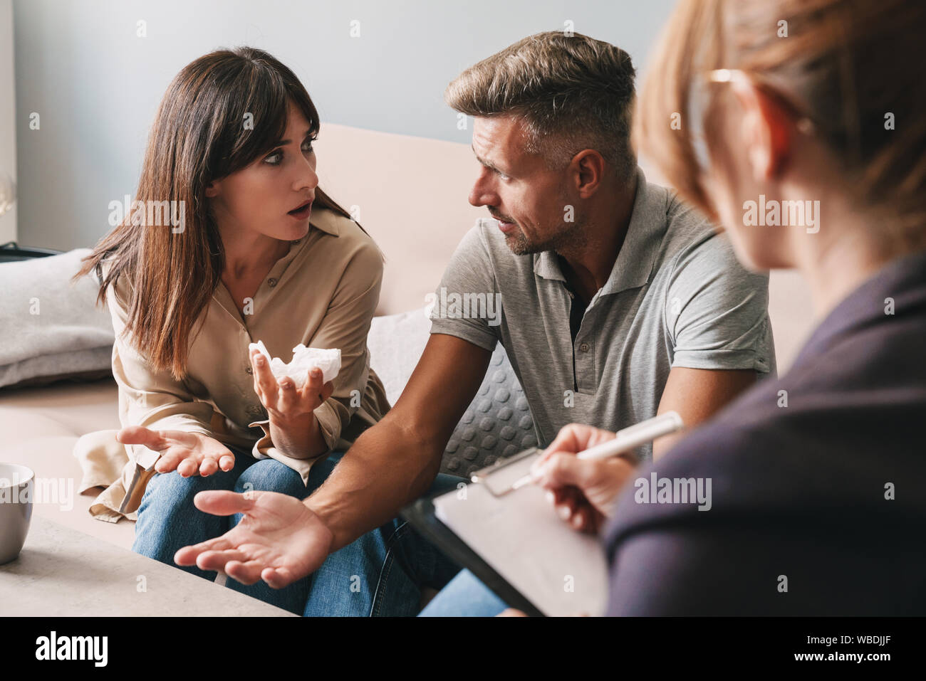 Photo of irritated unhappy couple man and woman having conversation ...