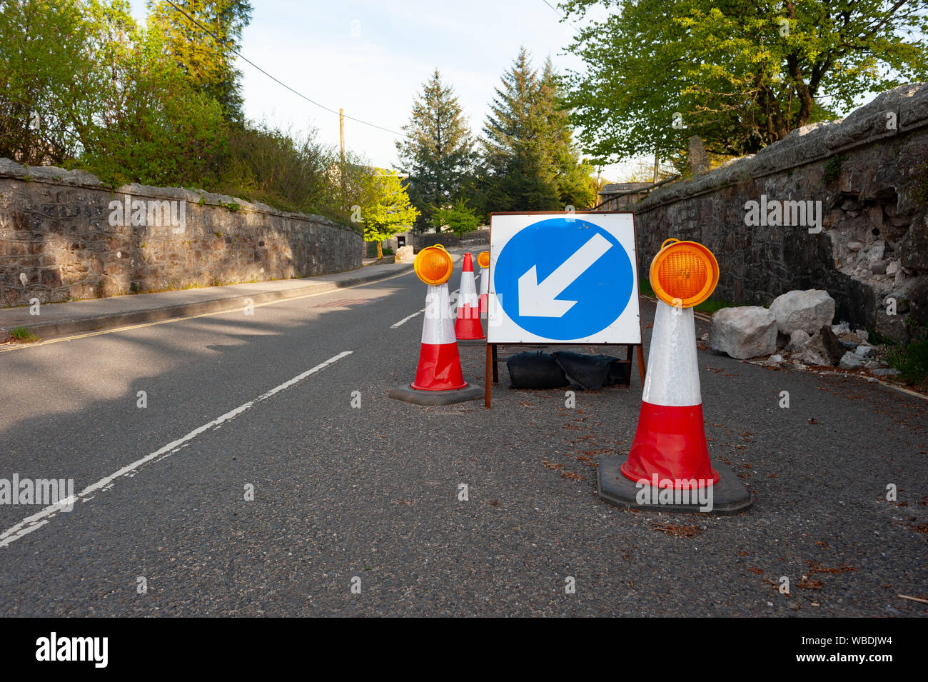 Road work signs in UK village Stock Photo - Alamy