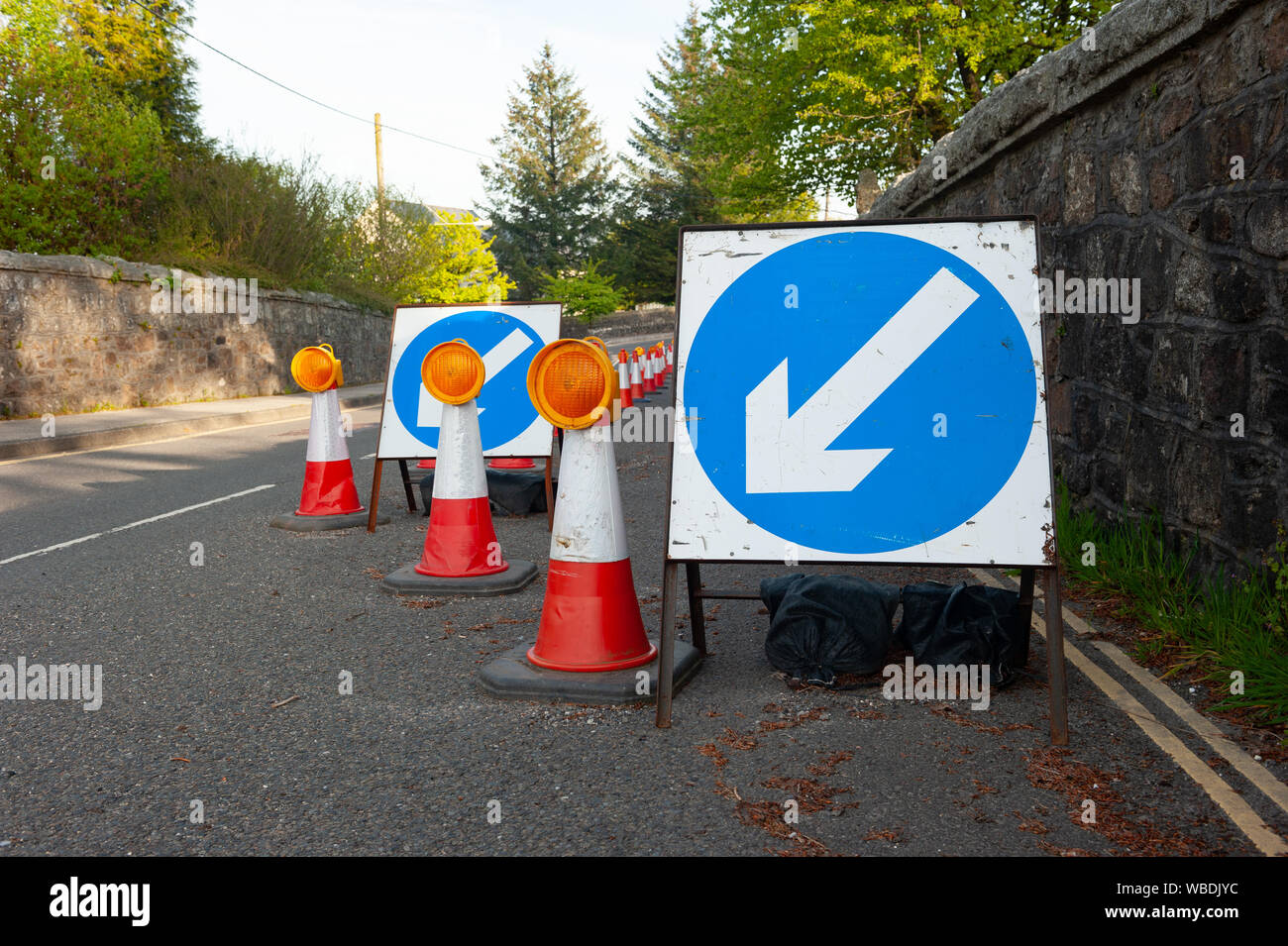 Road work signs in UK village Stock Photo - Alamy