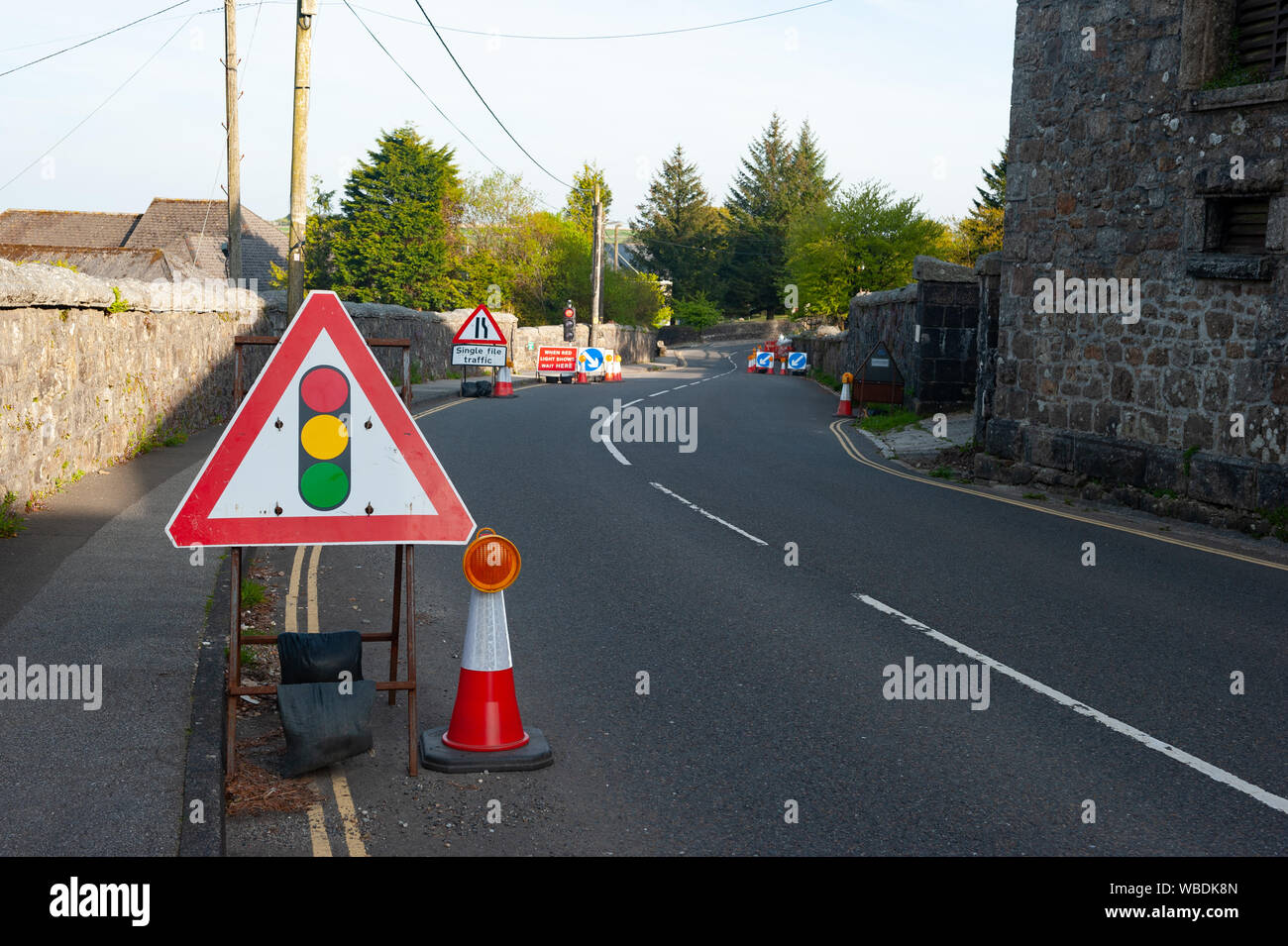 Road work signs in UK village Stock Photo - Alamy