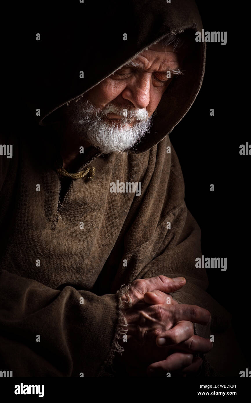 Medieval monk pensive in prayer Stock Photo - Alamy