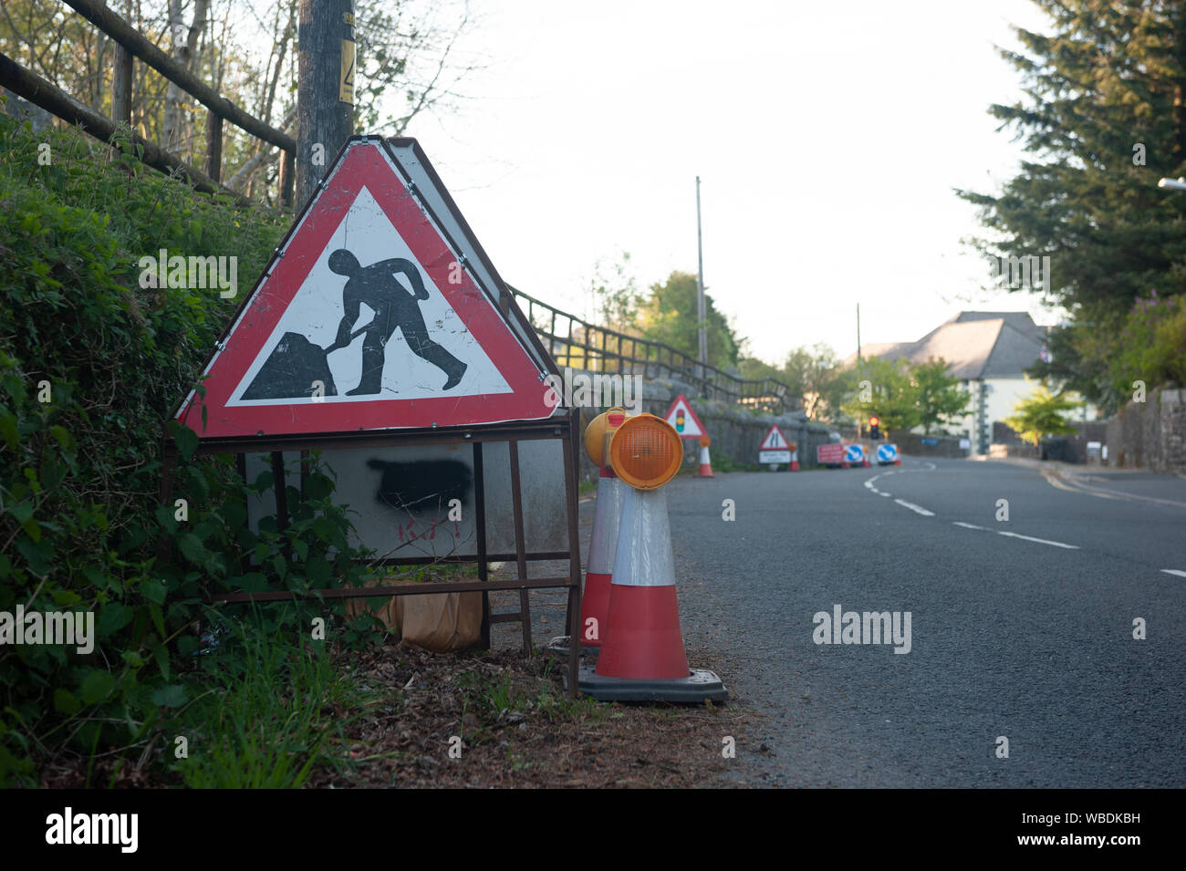 Road work signs in UK village Stock Photo - Alamy
