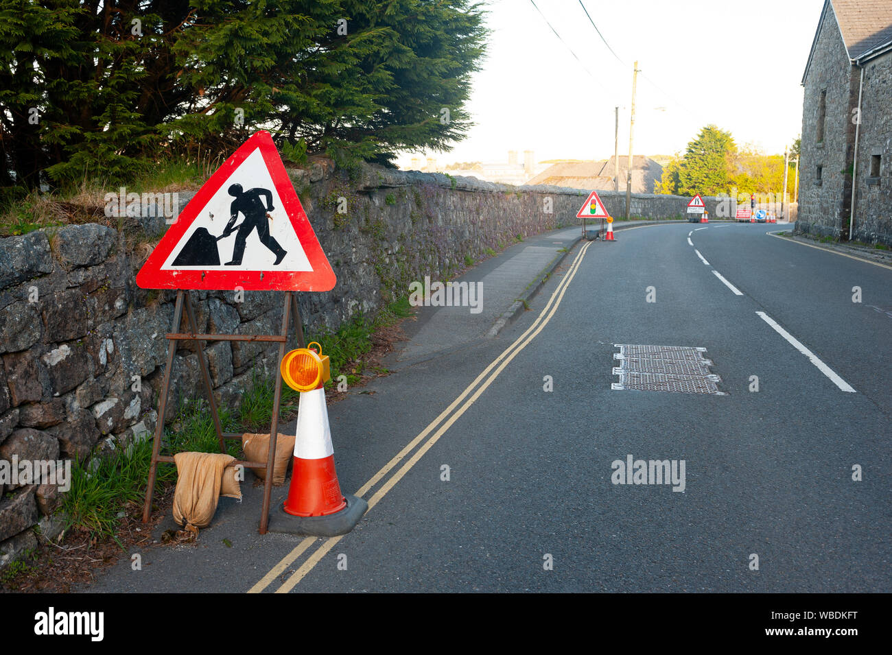 Road work signs in UK village Stock Photo - Alamy
