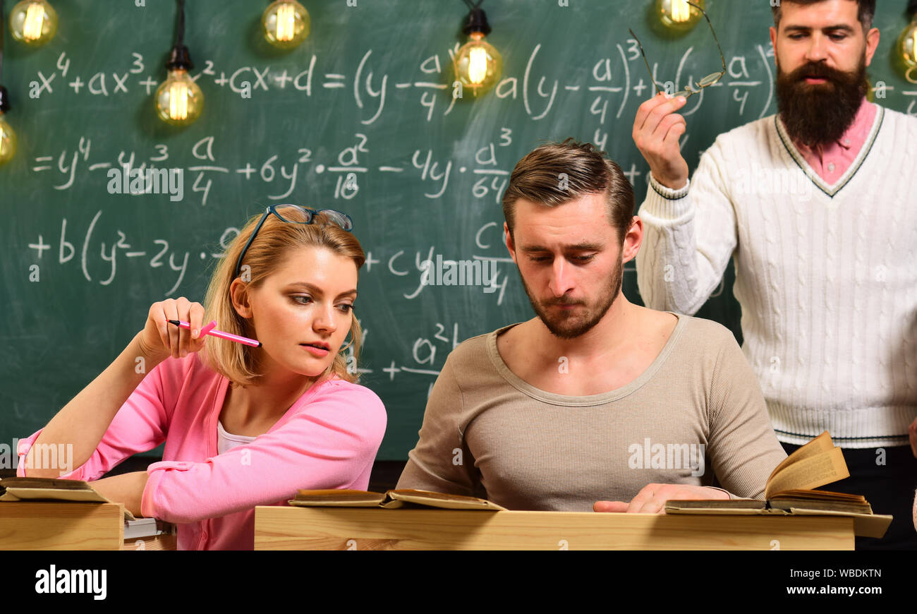 Bearded teacher, lecturer, professor watching students during test ...