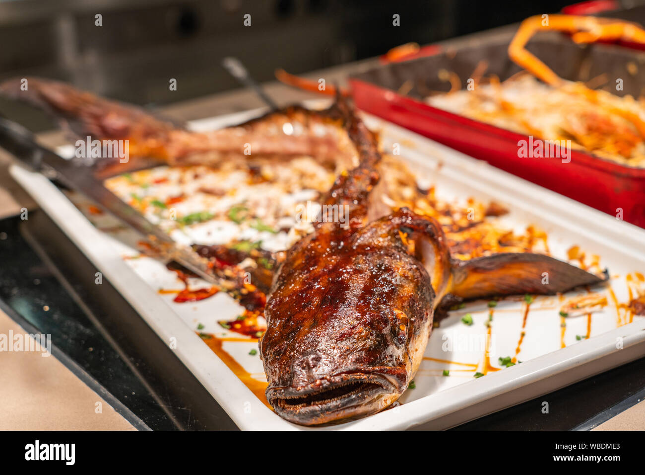 Delicious grilled catfish on the square plate in restaurant Stock Photo ...