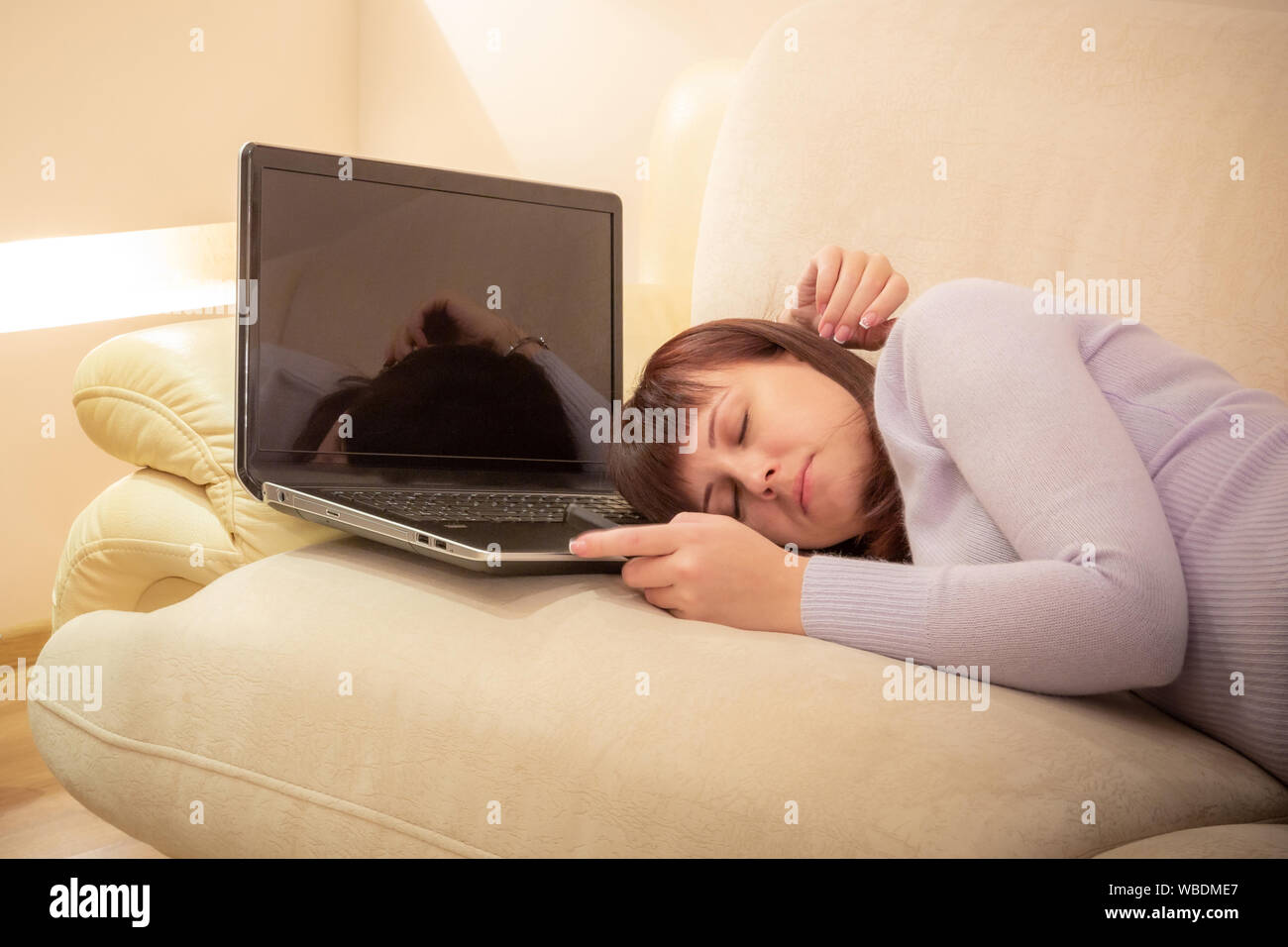 Tired woman sleeping right on her laptop's keyboard Stock Photo - Alamy