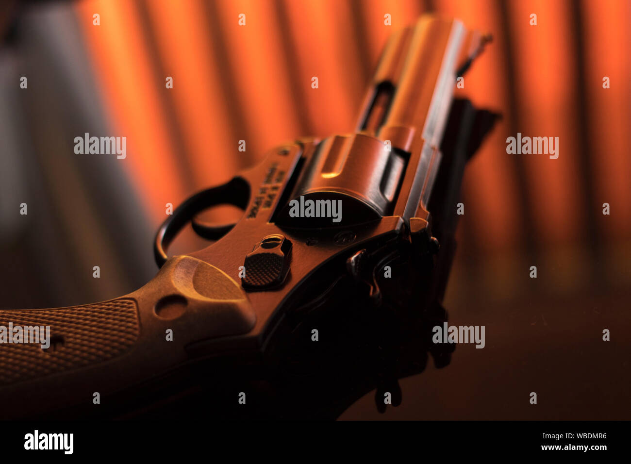 Pistol automatic handgun weapon on table in hotel bedroom in ...