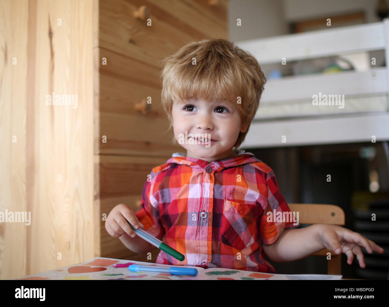 Painter child with coloring book. Childhood and happiness, learning ...