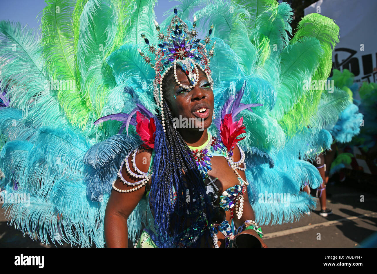 A dancer performs during the the Notting Hill Carnival in west London ...