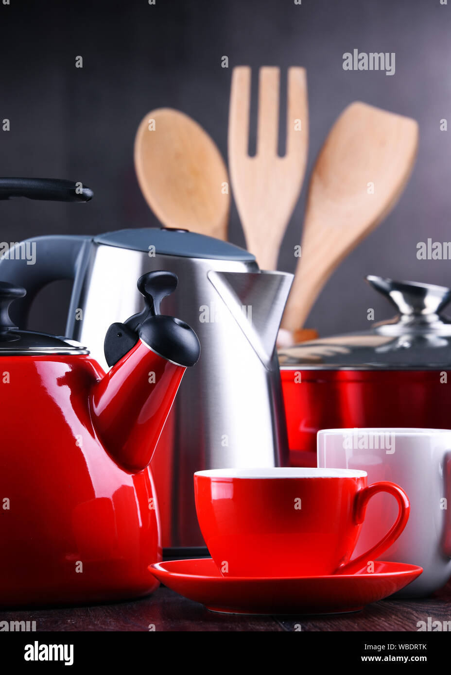 Composition with kitchen vessels, kettles and cups Stock Photo - Alamy