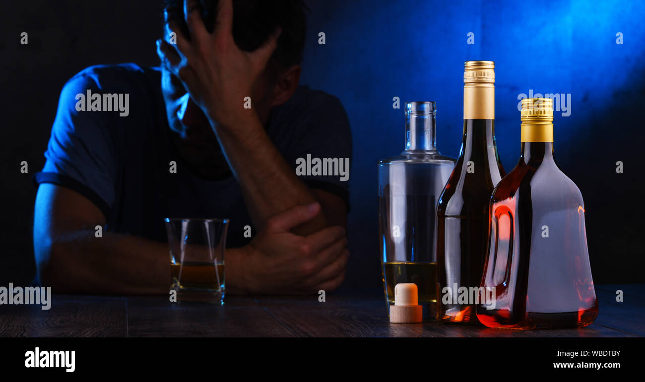 Bottles with alcoholic beverages and the figure of a drunk man Stock ...