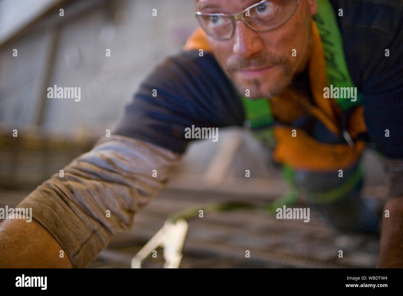 Dirty mid-adult construction worker Stock Photo - Alamy