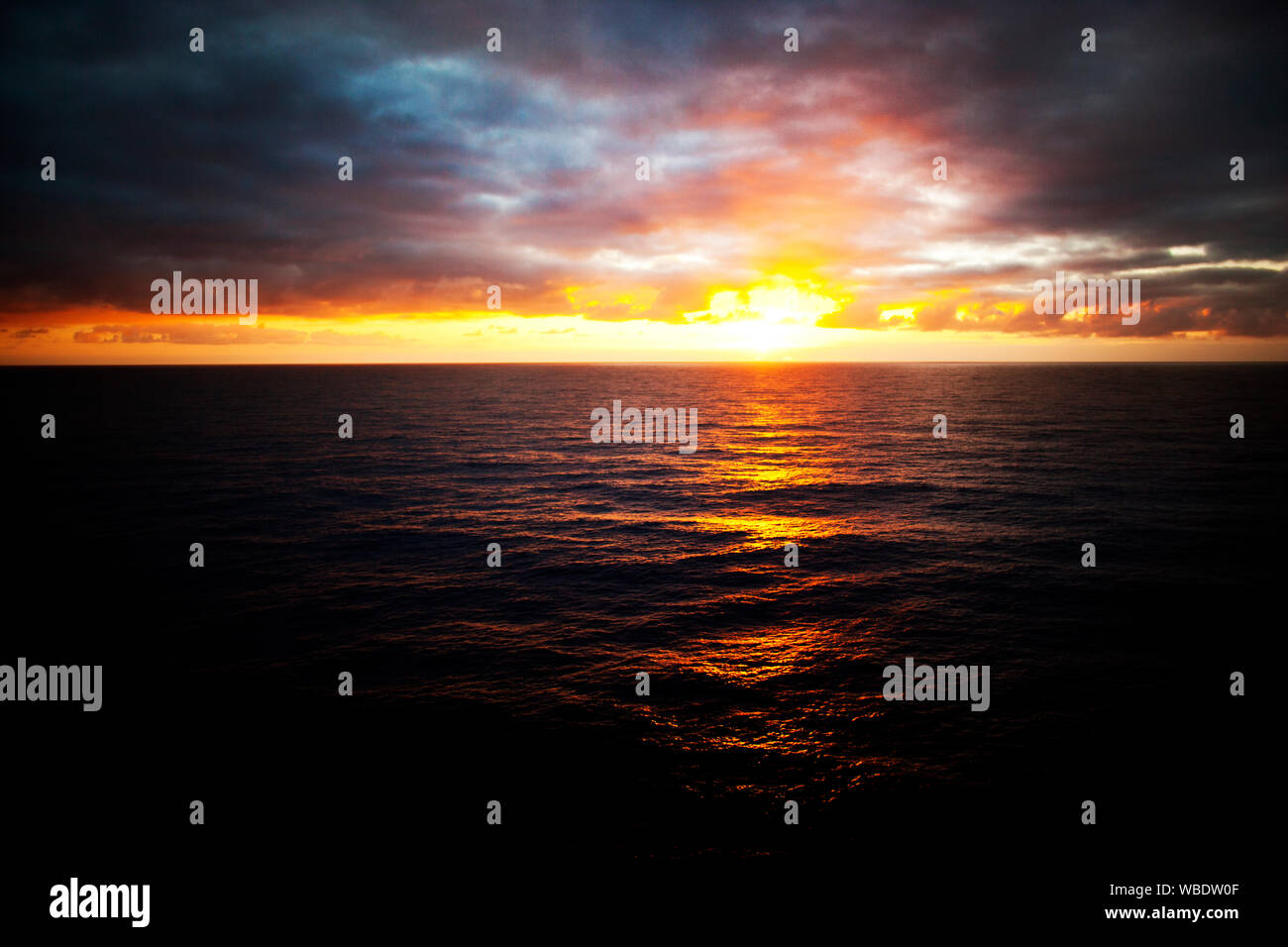 Sun rise over ocean Stock Photo - Alamy