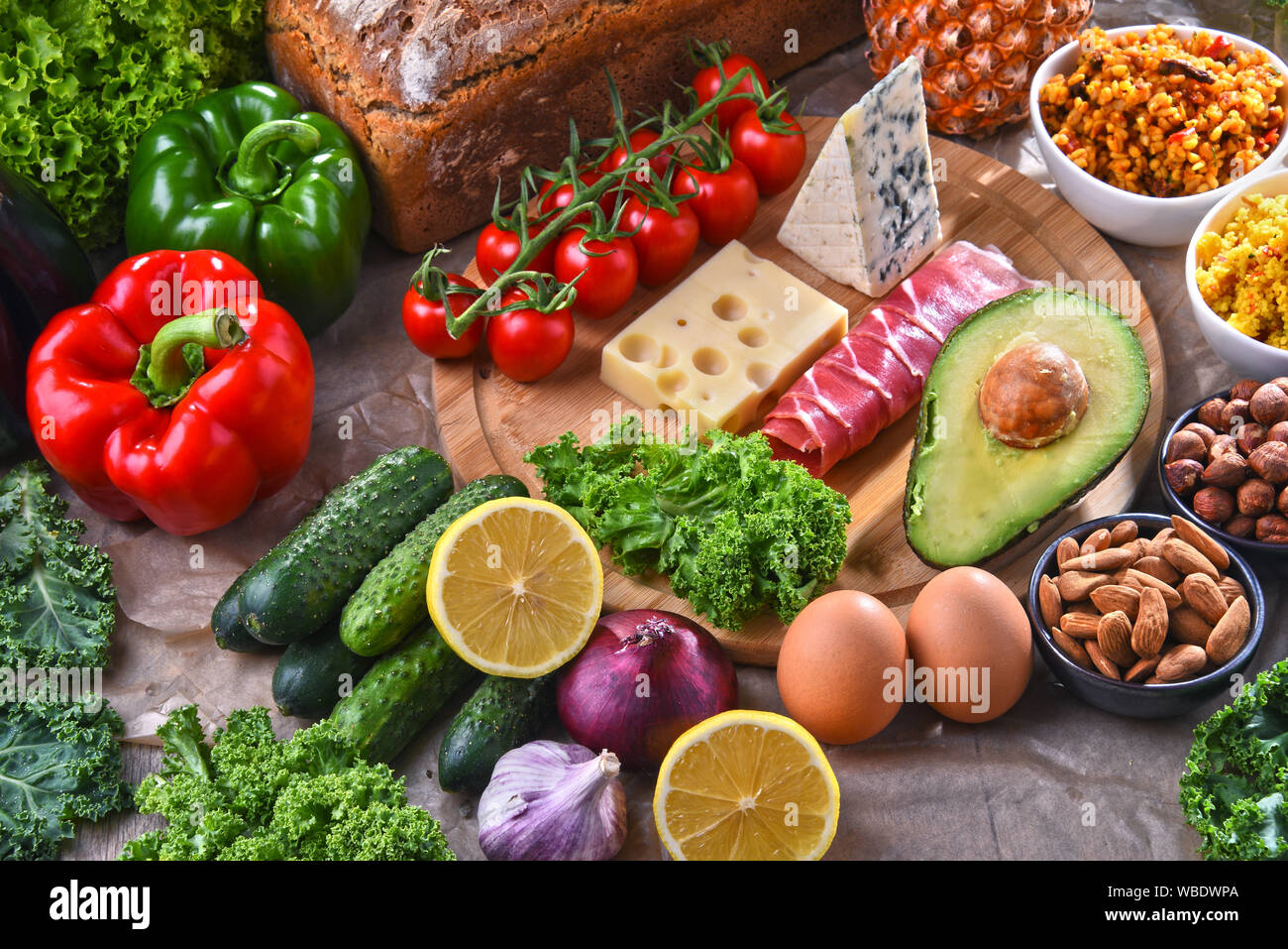 Composition with assorted food products on kitchen table Stock Photo ...