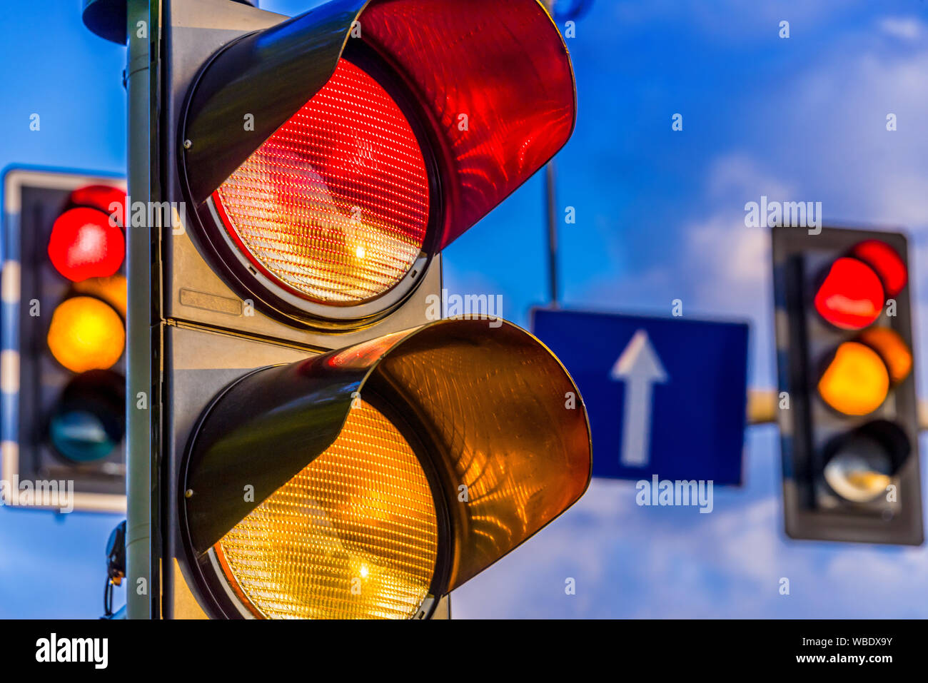 Traffic lights over urban intersection. Red light Stock Photo - Alamy